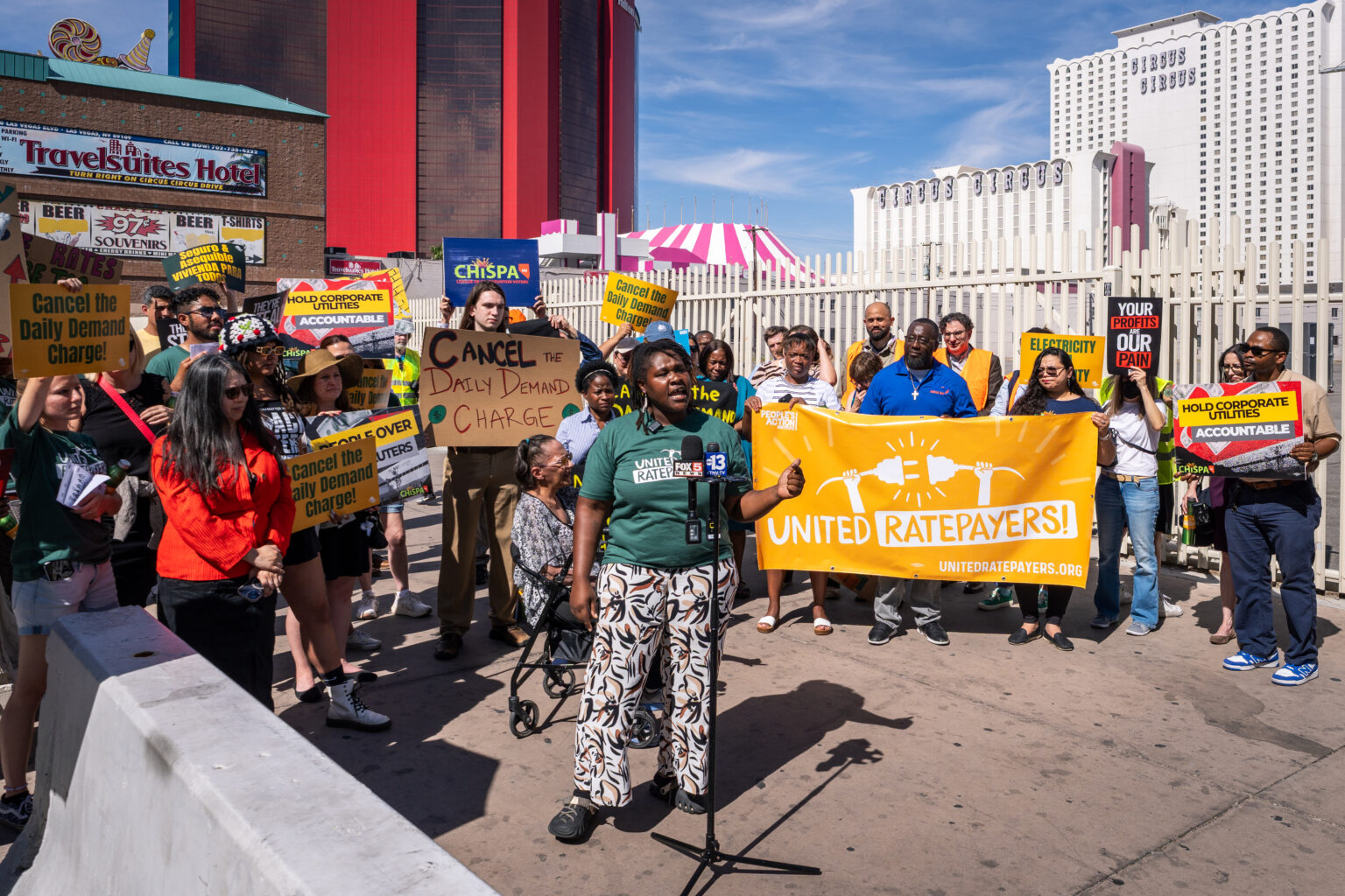 Utility customers and advocates meet outside a summit of utility ...