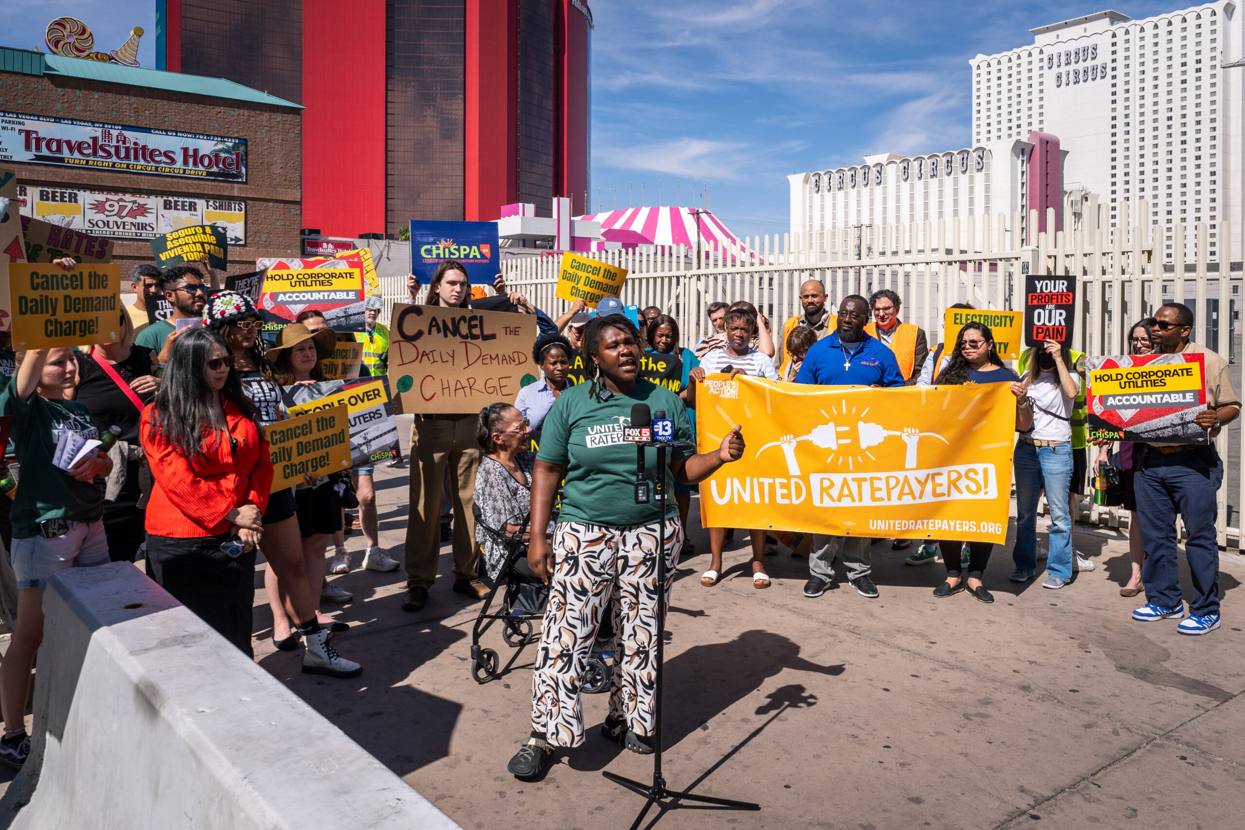 Utility customers and advocates meet outside a summit of utility ...